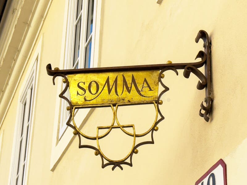 Vintage Signage on Historic Building with Decorative Metalwork and ...