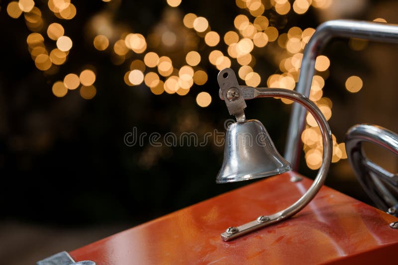 Vintage Silver Bell on Red Surface with Blurred Golden Lights ...