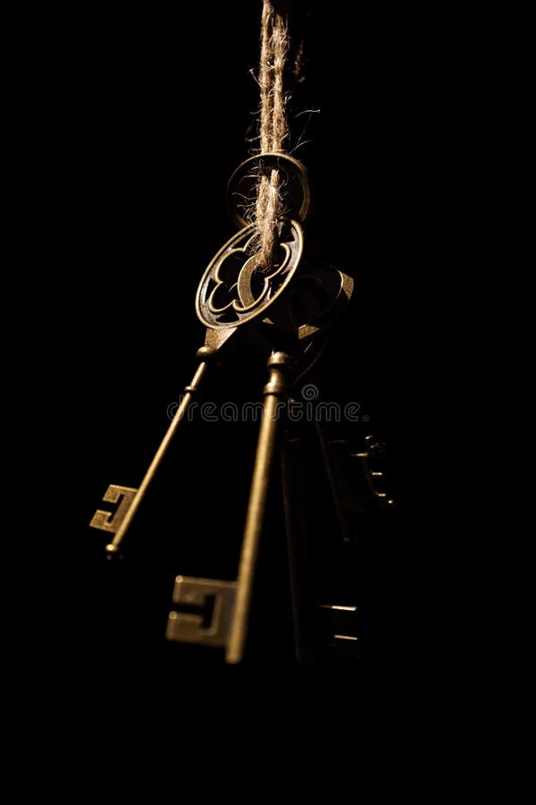 Vintage Skeleton Keys on Jute String Against Black Background Stock ...
