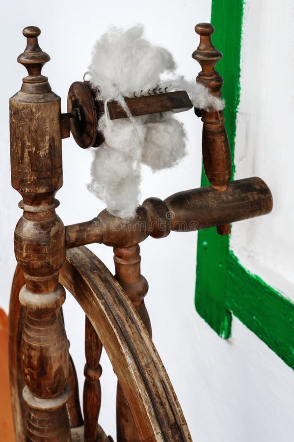 Vintage Spinning Wheel with a Bundle of Yarn in Close-up. Vintage ...