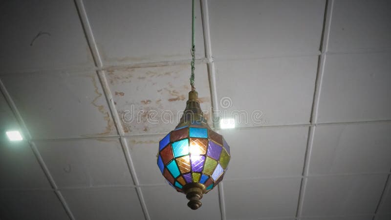 Hanging Lamp on a Track in Front of a Forest of Metal and Glass ...