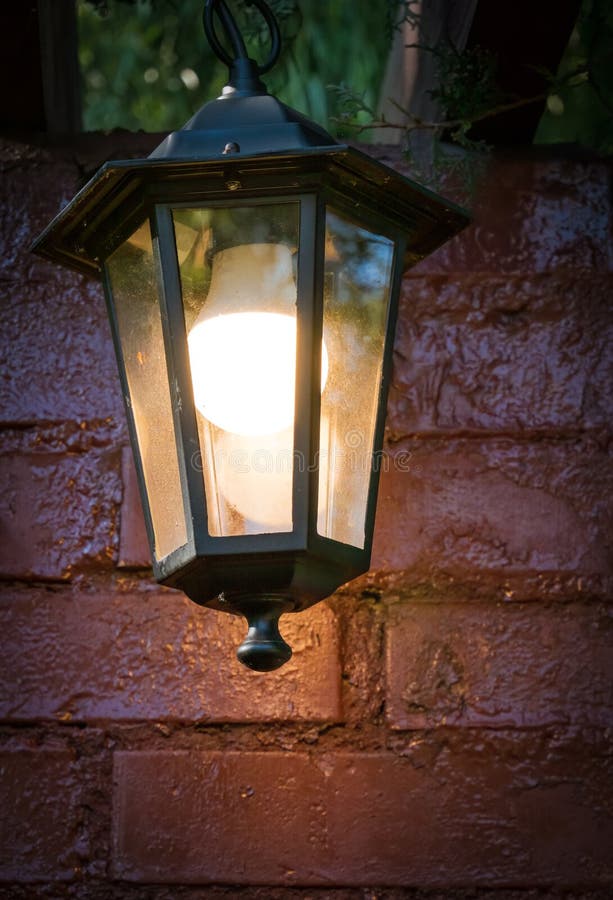 Vintage Street Lamp or Lamp Post Hanging in Front of a Red Brick Wall ...