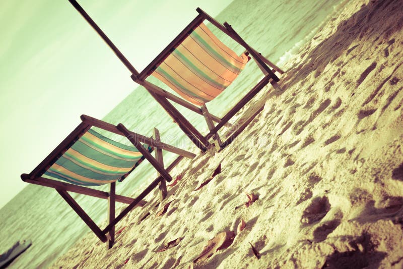 Style Deck Chairs on a Sunny Beach Facing the Tranquil Sea Stock Photo ...