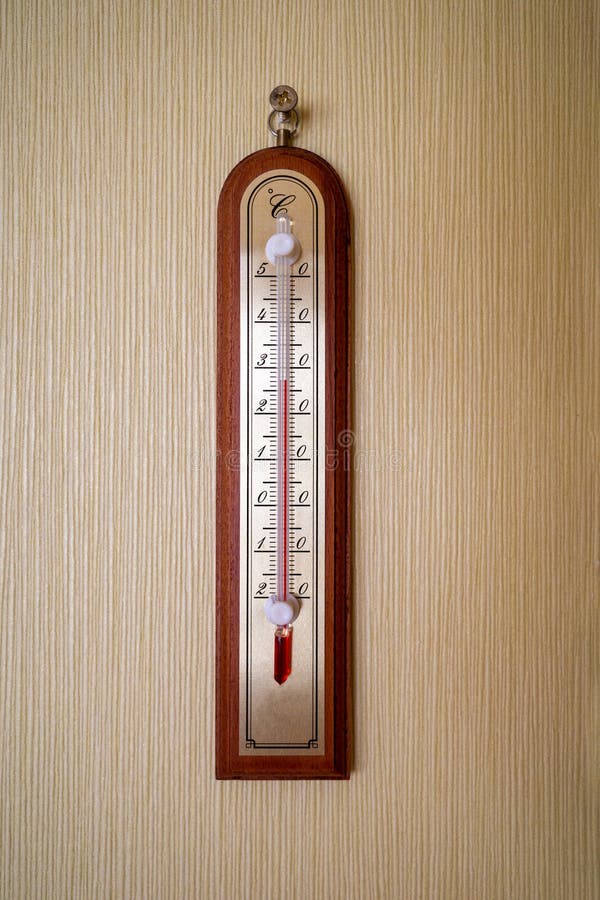 A Vintage-style Indoor Mercury Thermometer Hangs on the Wall Stock ...