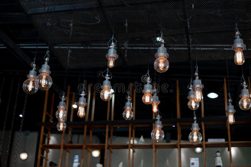 Vintage Style Light Bulb in a Cafe Shop Stock Image - Image of power ...