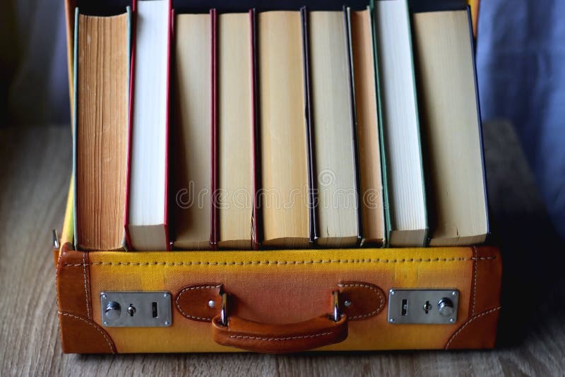 Suitcase and Books stock photo. Image of suitcase, shelf - 274994940