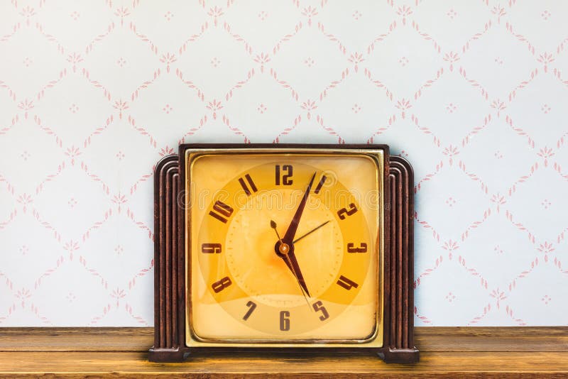 Vintage Table Clock in Front of Retro Wallpaper Stock Photo - Image of ...