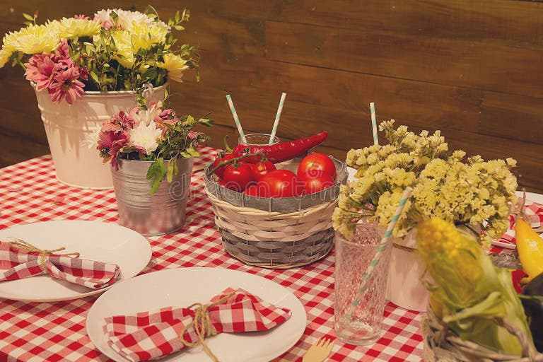 Vintage Table Setting with Tomatoes Peppers and Flowers Stock Image ...