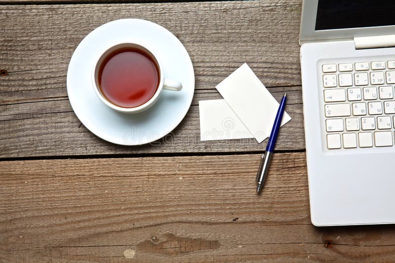 On Vintage Table Tea,laptop and Business Cards Stock Photo - Image of ...