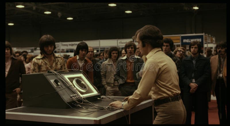 Vintage Technology Expo Crowd Observes Man Demonstrating Early Computer ...