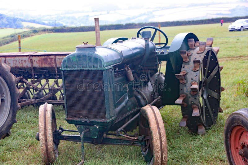 Vintage Tractors in a Field Stock Photo - Image of agriculture, grass ...