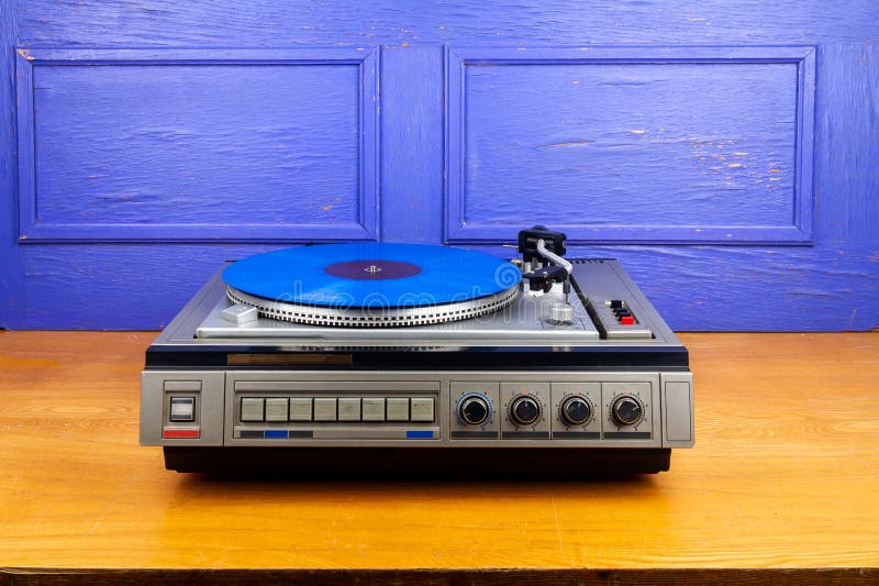 Vintage Turntable Vinyl Record Player with Blue Vinyl Stock Photo ...
