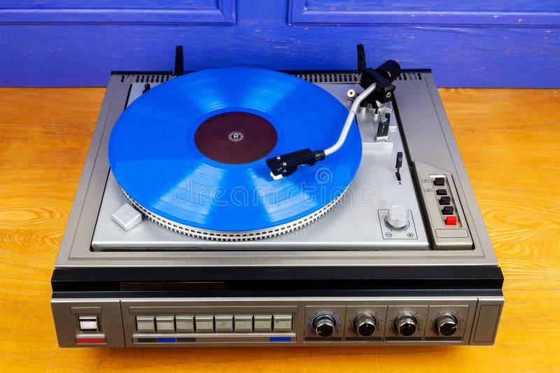 Vintage Turntable Vinyl Record Player with Blue Vinyl Stock Photo ...