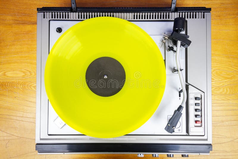 Vintage Turntable Vinyl Record Player with Yellow Vinyl Stock Photo ...