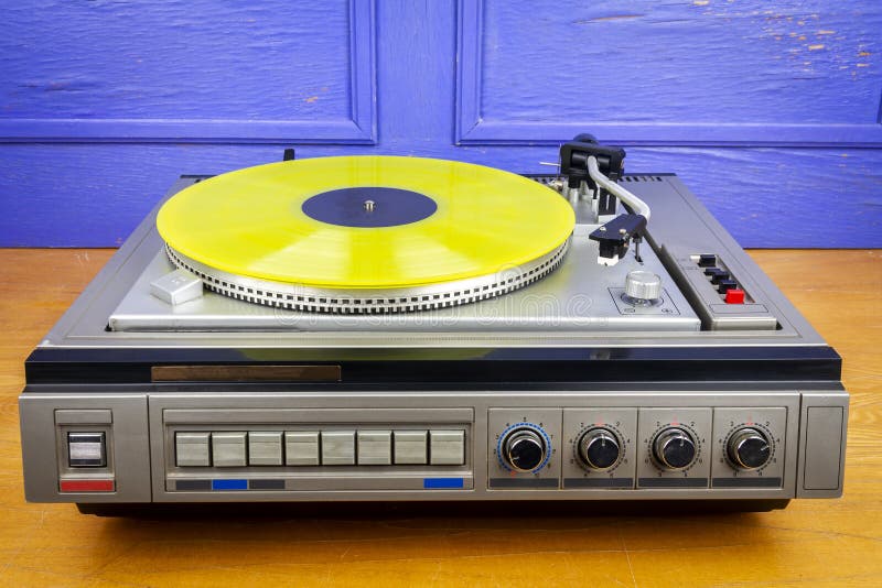 Vintage Turntable Vinyl Record Player with Yellow Vinyl Stock Photo ...