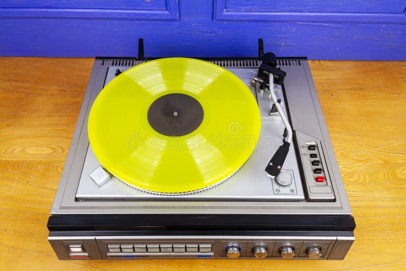Vintage Turntable Vinyl Record Player with Yellow Vinyl Stock Image ...