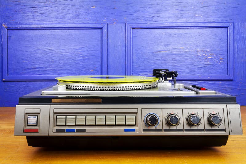 Vintage Turntable Vinyl Record Player with Yellow Vinyl Stock Image ...