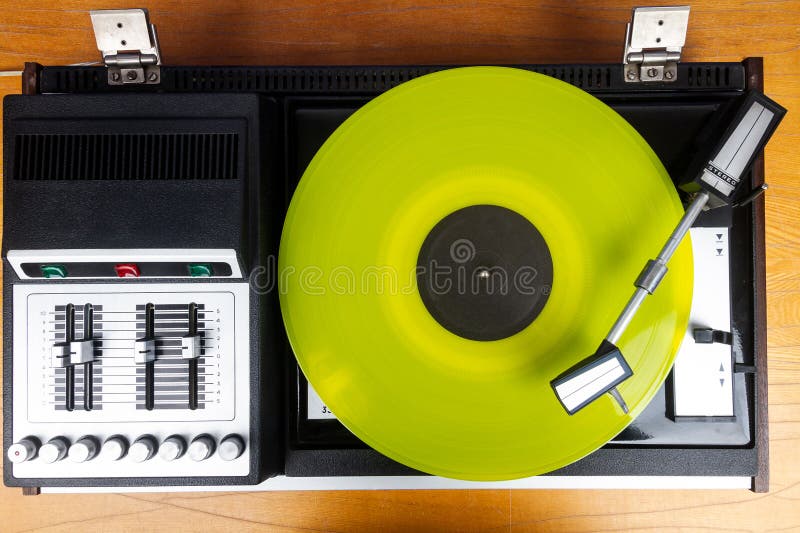 Vintage Turntable Vinyl Record Player with Yellow Vinyl Stock Photo ...