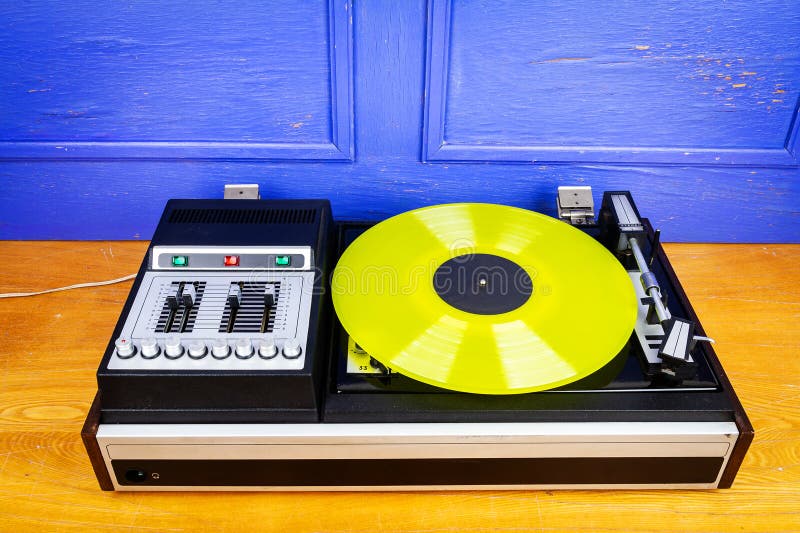 Vintage Turntable Vinyl Record Player with Yellow Vinyl Stock Image ...