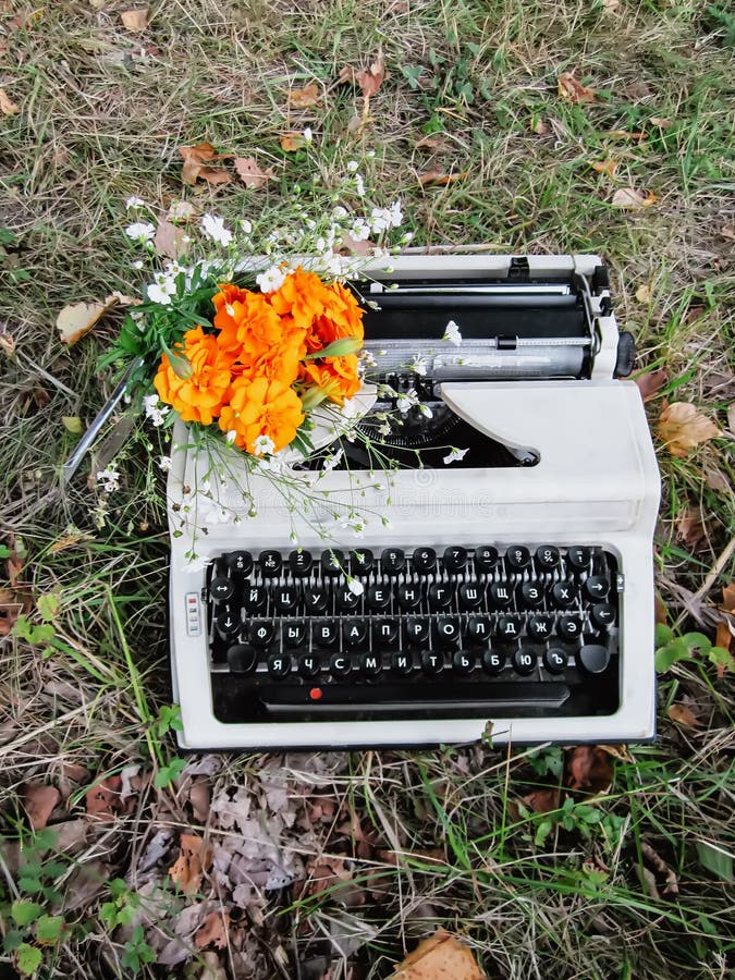 Vintage Typewriter Machine and Summer Flowers Outdoors Stock Image ...
