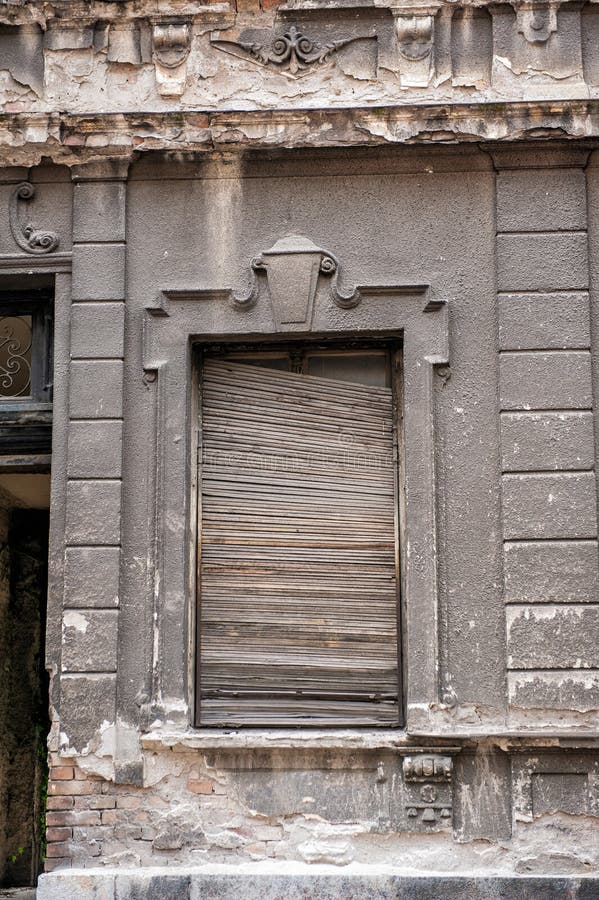 Vintage Urban Decay Featuring Distressed Windows and Aged Exterior ...