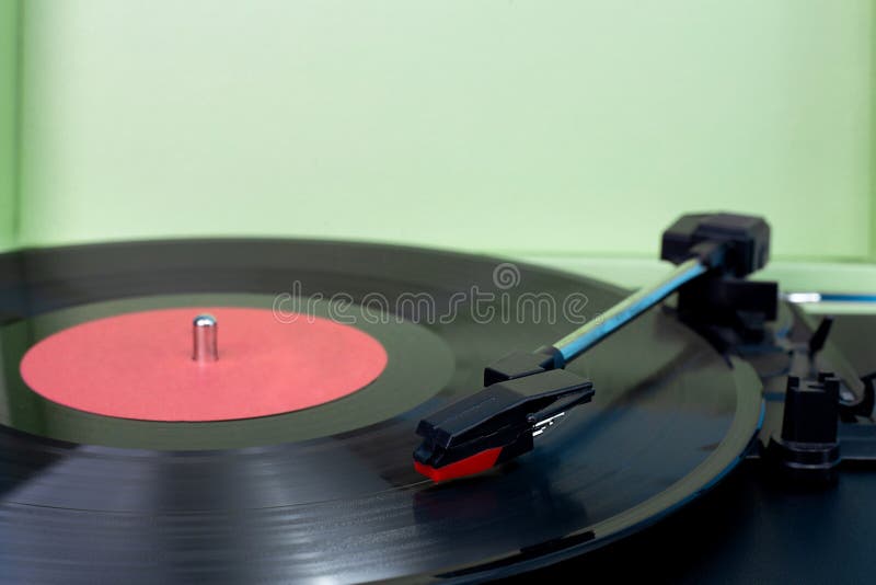 Vintage Vinyl Player Close Up with Black Vinyl Record Stock Photo ...