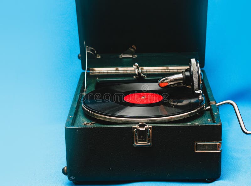 Vintage Vinyl Record Player on Blue Background. Retro Concept. Vinyl ...