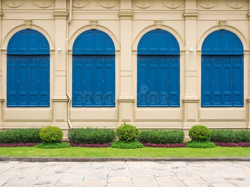 Blue Windows and a Stone Wall Stock Photo - Image of french, building ...