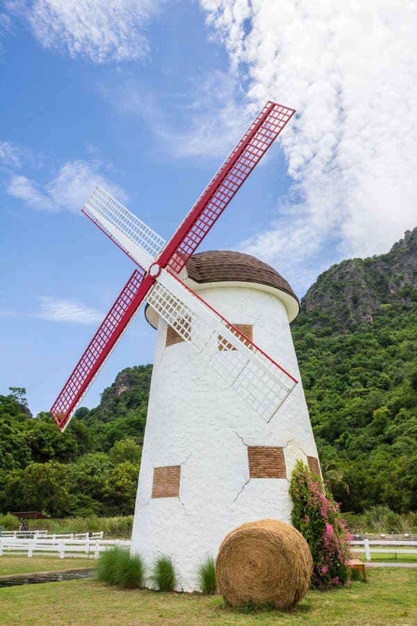 Vintage Windmill with Straw Bales Stock Photo - Image of landscape ...
