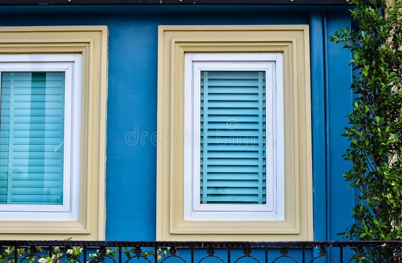 Vintage Windows on the Blue Wall Stock Photo - Image of vintage, wall ...