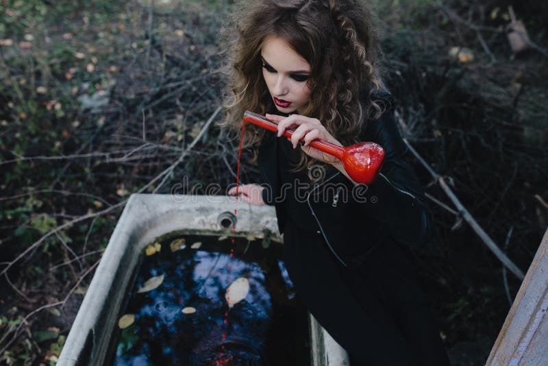 Vintage Witch with Elixir in Hand Stock Photo - Image of halloween ...