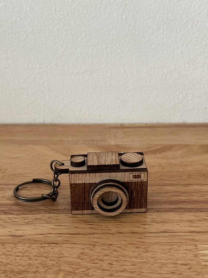 Vintage Wooden Camera with a Blank Tag on a Wooden Background Stock ...