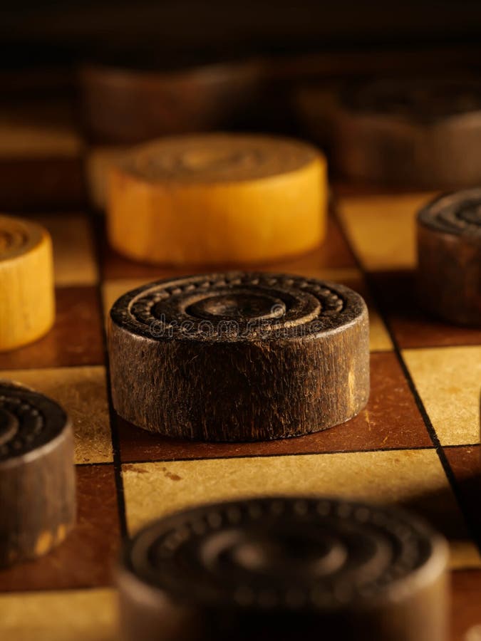 Vintage Wooden Checkerboard with Brown and Cream Colored Checkers ...