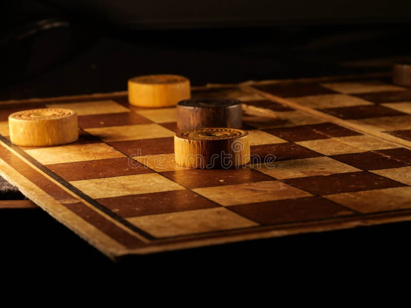 Vintage Wooden Checkerboard with Brown and Cream Colored Checkers ...