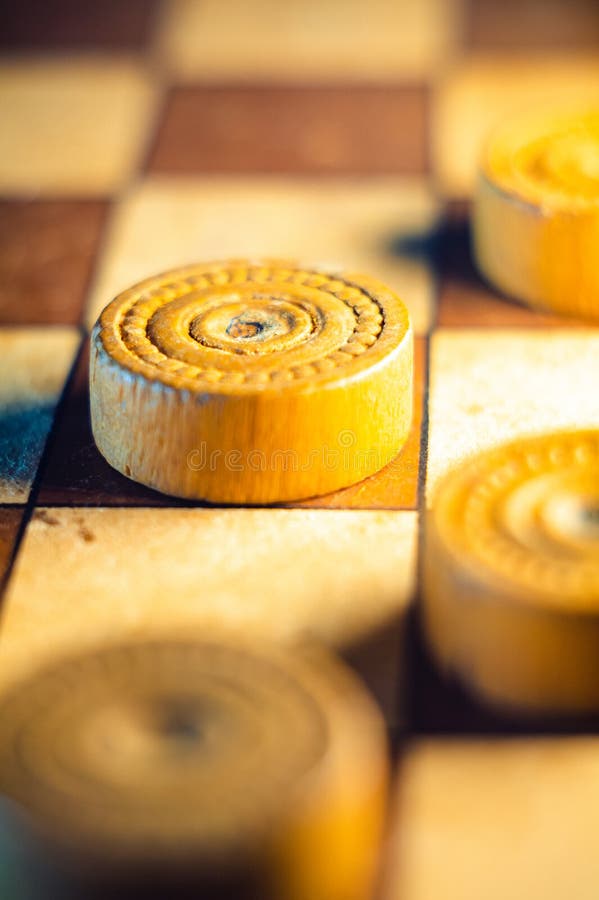 Vintage Wooden Checkerboard with Brown and Cream Colored Checkers ...