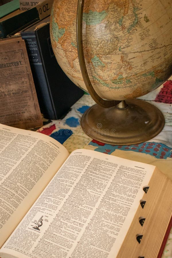 Vintage World Globe and Old Dictionary on Table Stock Image - Image of ...
