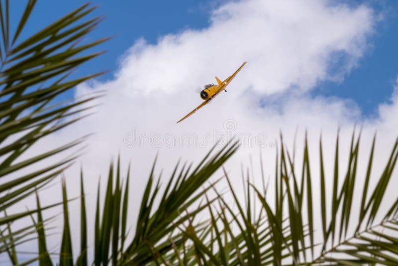 An Vintage Yellow Aircraft Flying in Blue Sky Stock Image - Image of ...