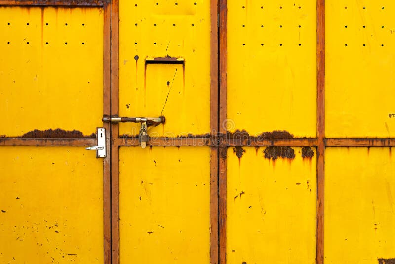 Vintage Yellow Metal Fence with Rusty Door Stock Photo - Image of ...