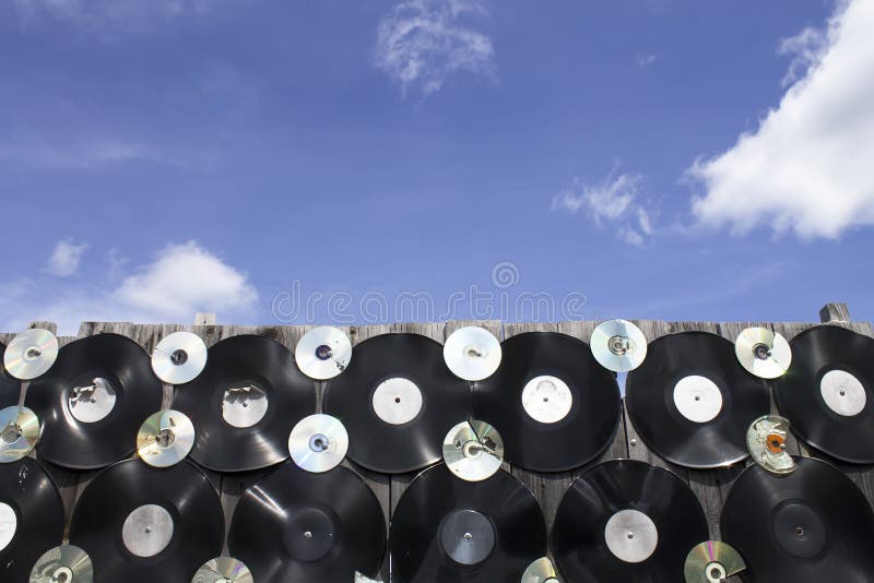 Vinyl and Cracked Cd Disks are Screwed To the Fence Stock Photo - Image ...