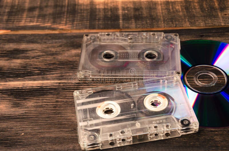 Vinyl Disc and Cassette Tapes on the Wooden Table. Stock Photo - Image ...