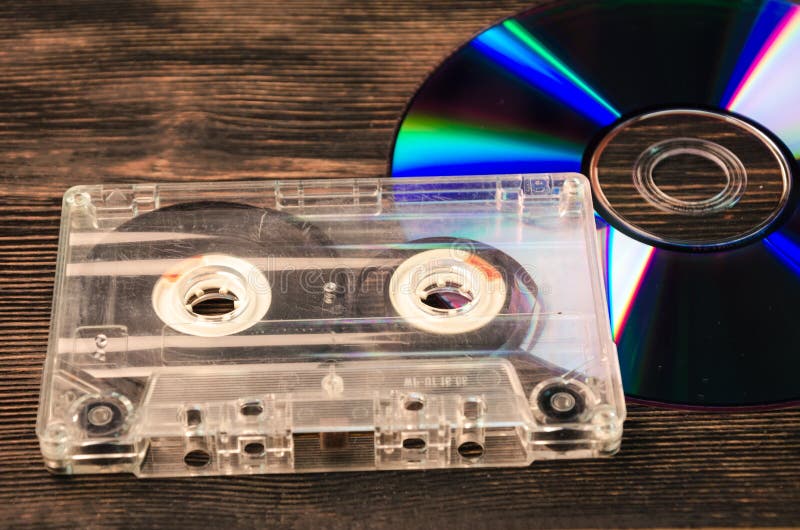 Vinyl Disc and Cassette Tapes on the Wooden Table. Stock Image - Image ...