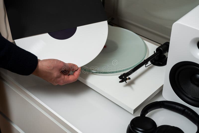 Vinyl LP Tracks with Modern Needle Player. Musician Changes Vinyl ...