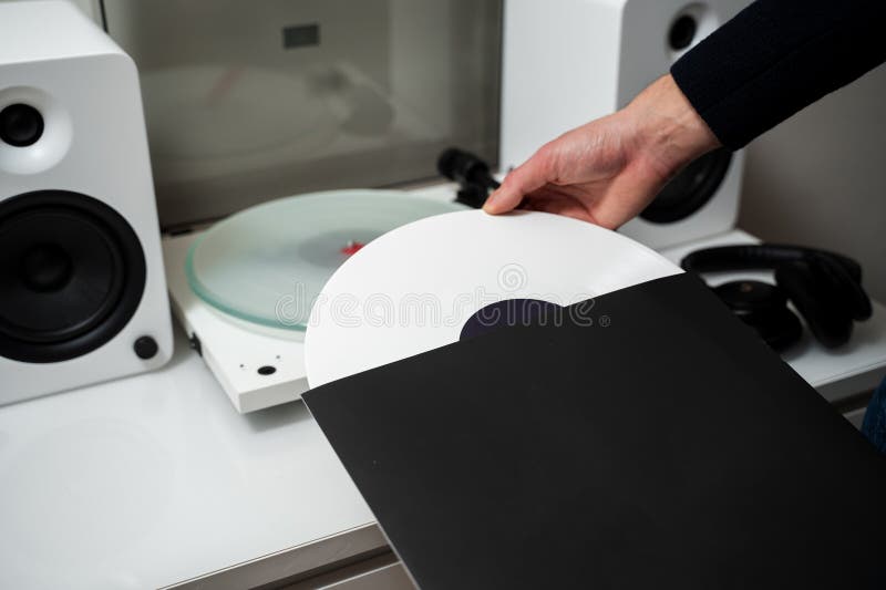 Vinyl LP Tracks with Modern Needle Player. Musician Changes Vinyl ...