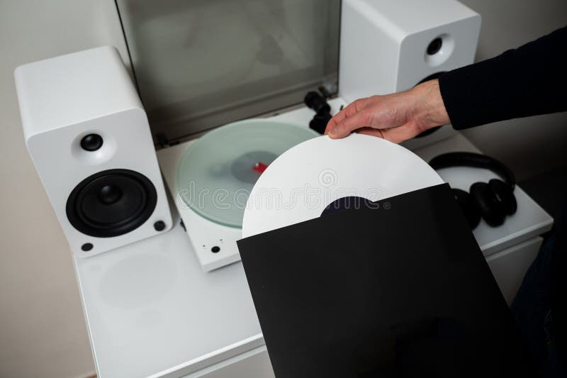 Vinyl LP Tracks with Modern Needle Player. Musician Changes Vinyl ...