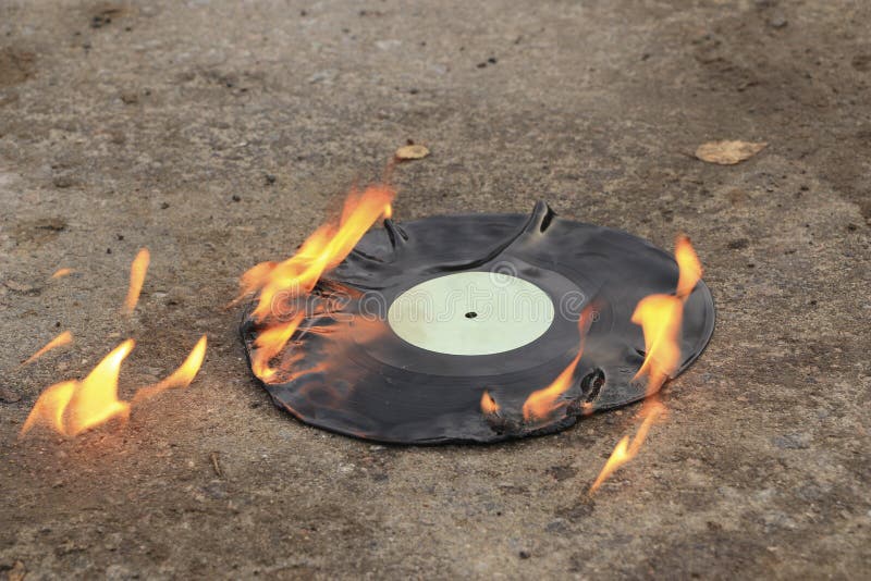Vinyl Record Burns Bright Orange Flame on the Asphalt Stock Image ...