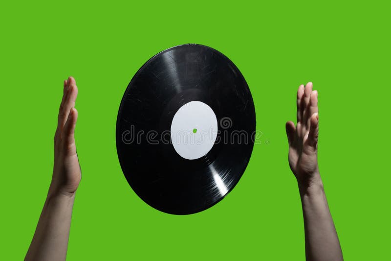 A Vinyl Record Elegantly Floating between Two Hands Against a Vibrant ...