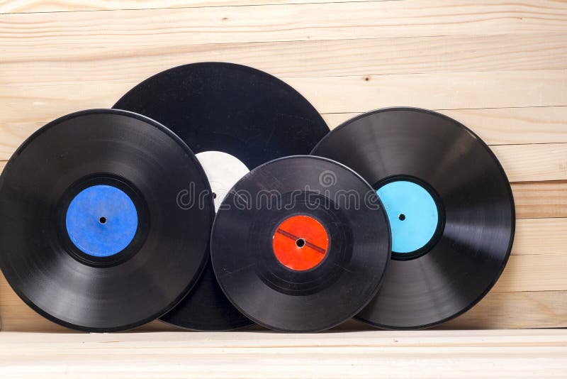 Vinyl Record in Front of a Collection of Albums, Vintage Process. Copy ...