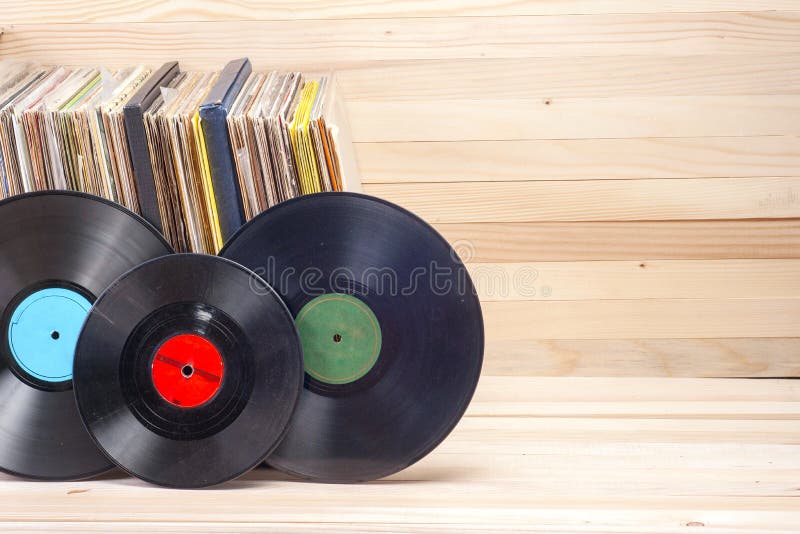 Vinyl Record in Front of a Collection of Albums, Vintage Process. Copy ...