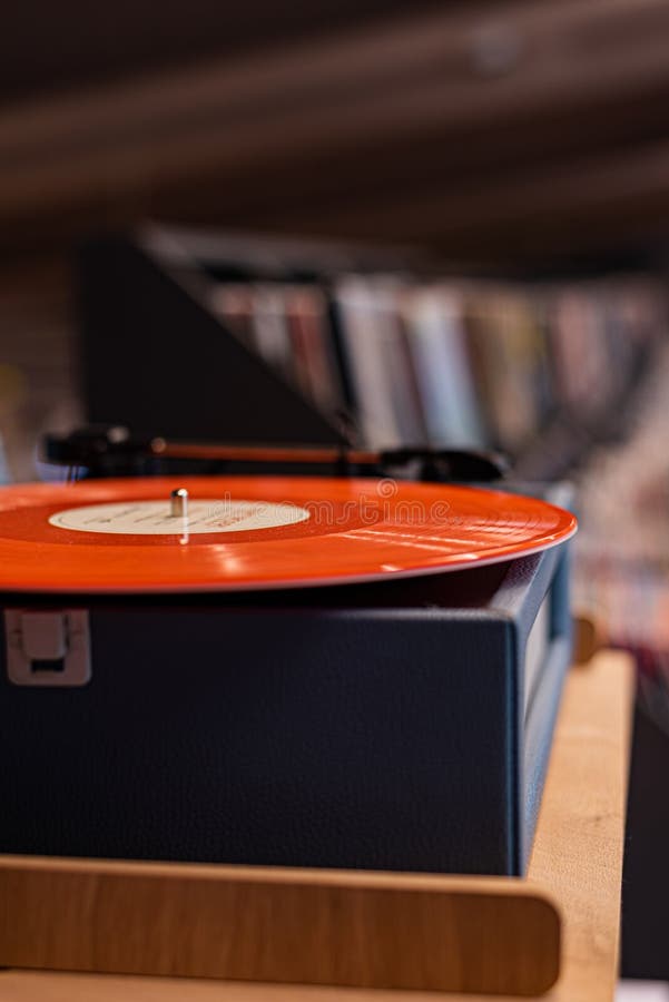A Vinyl Record Player on the Background of a Music Store Window ...