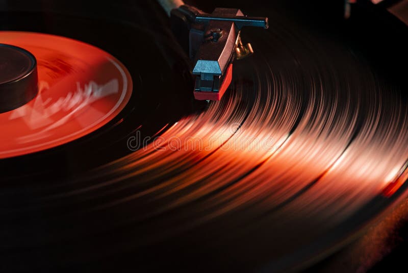Vinyl Record Playing on Turntable with Red Light Effect Stock ...